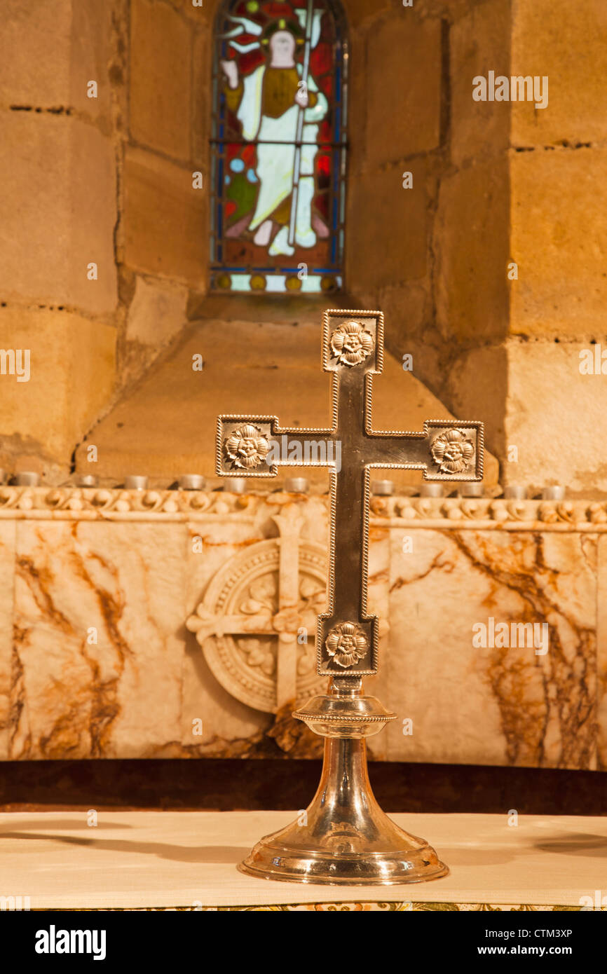A Gold Decorative Cross In Front Of A Stained Glass Window; Old Bewick ...