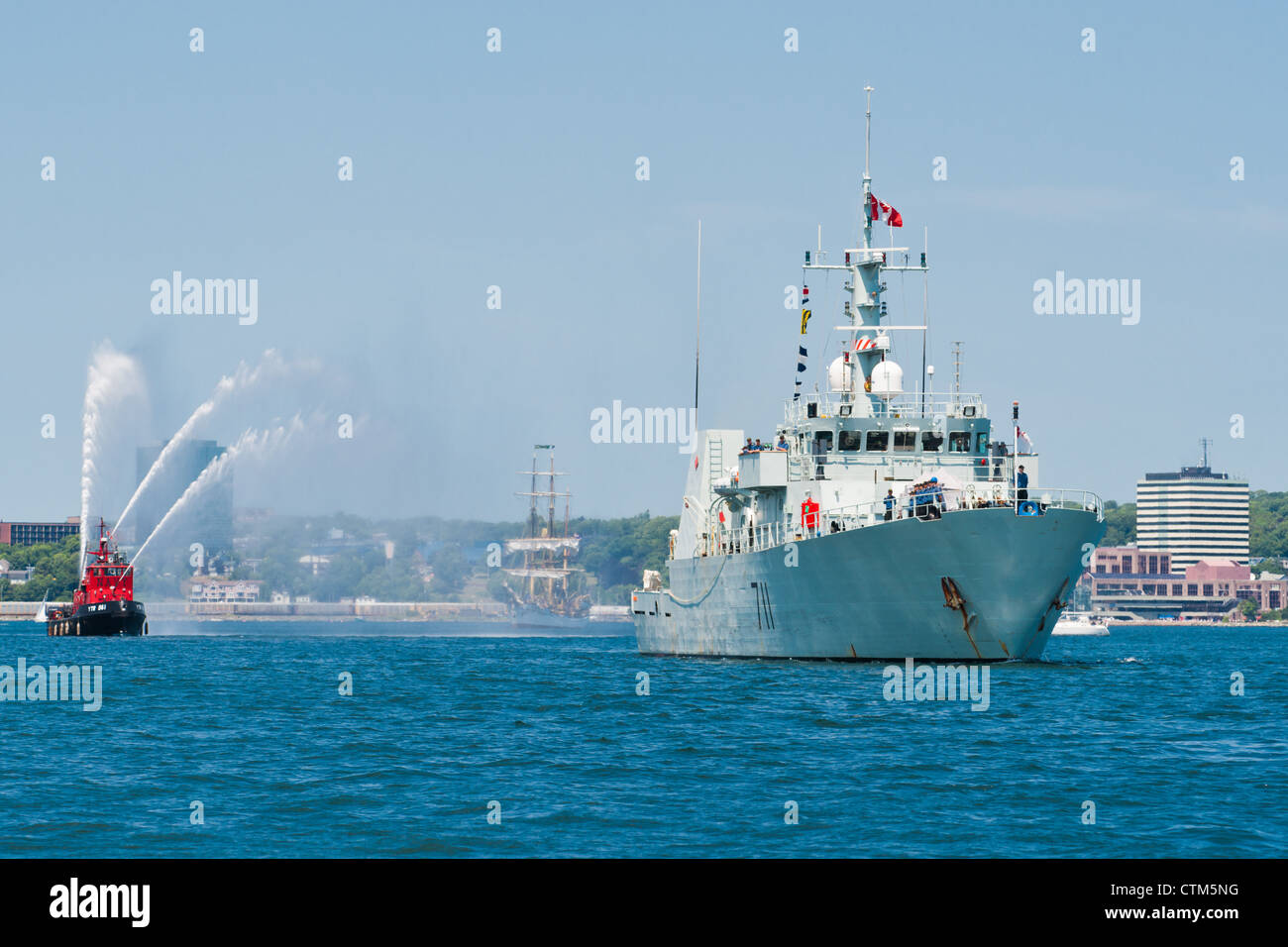 Royal Canadian Navy fireboat Firebird follows HMCS SUMMERSIDE (MM 711 ...