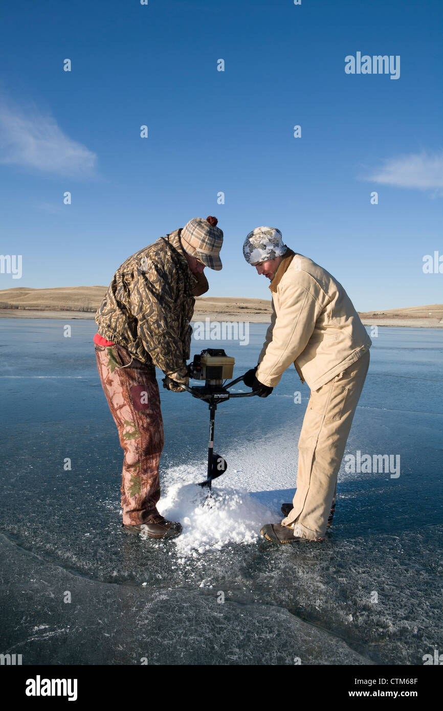 Drilling holes winter fishing hi-res stock photography and images - Alamy