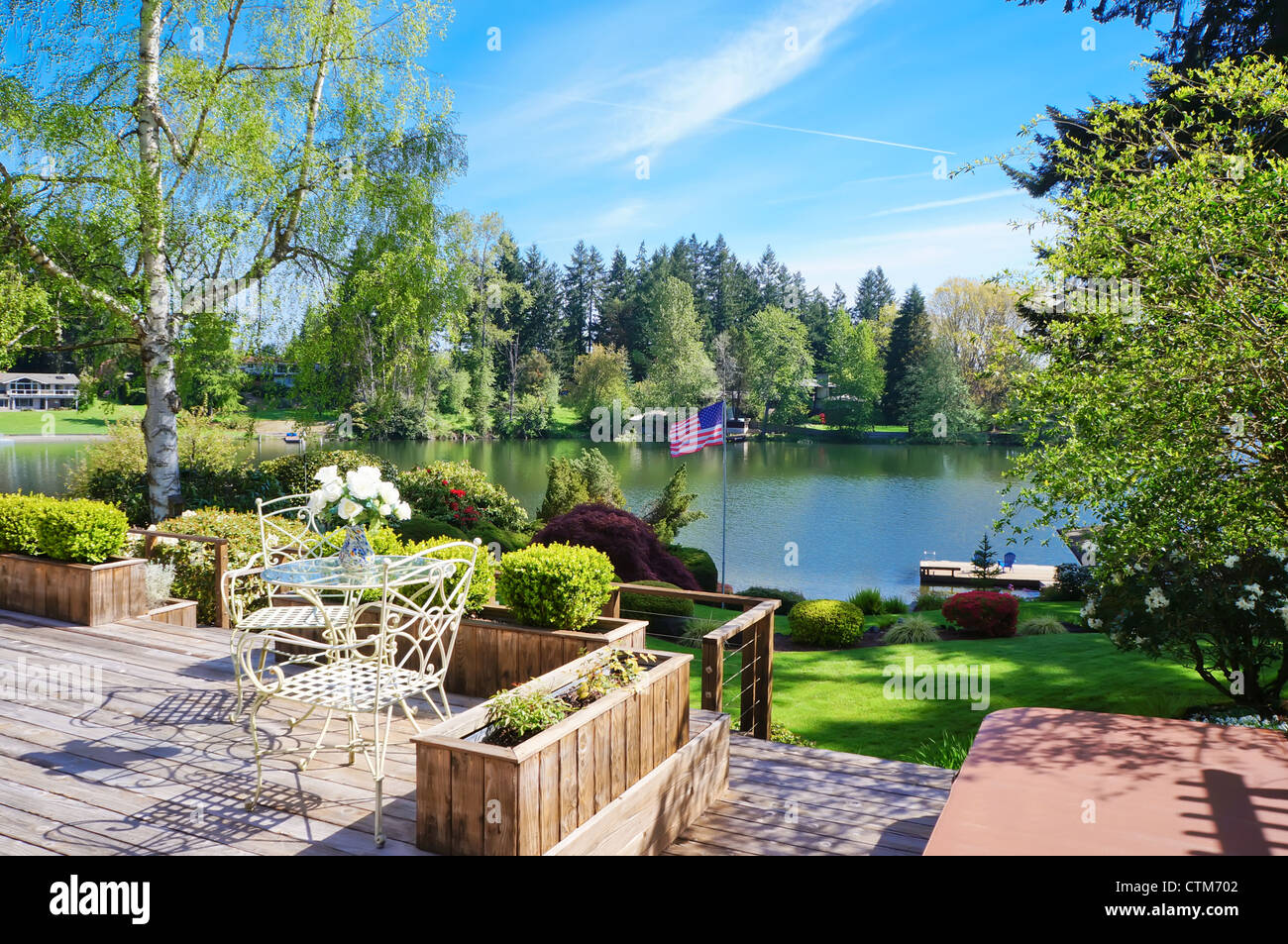 Beautiful deck near lake with spring landscape Stock Photo - Alamy