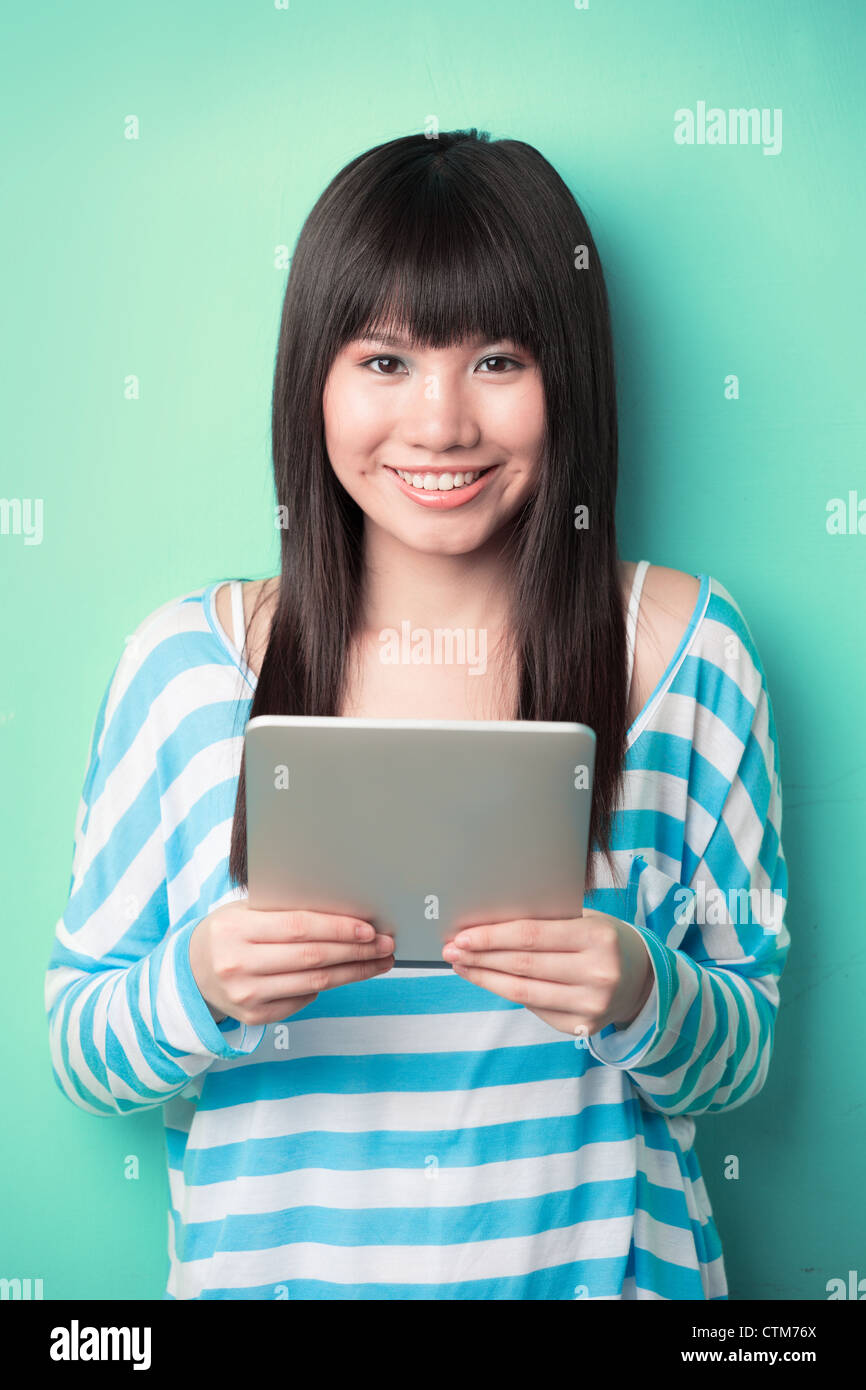 Asian girl tablet floor hi-res stock photography and images - Alamy