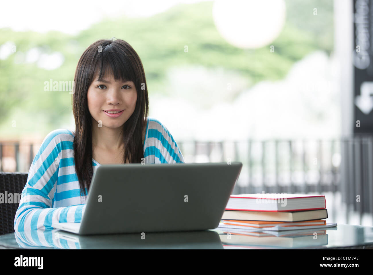 Chinese University student studying at her campus Stock Photo - Alamy