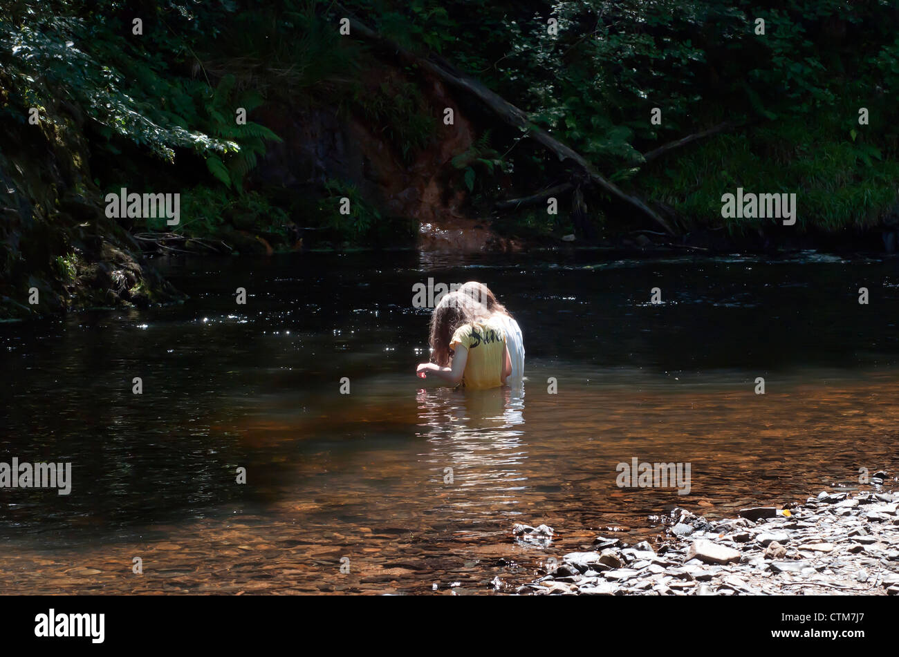 Girls wading in river teign,devon,dartmoor forest, beach, grass, green ...