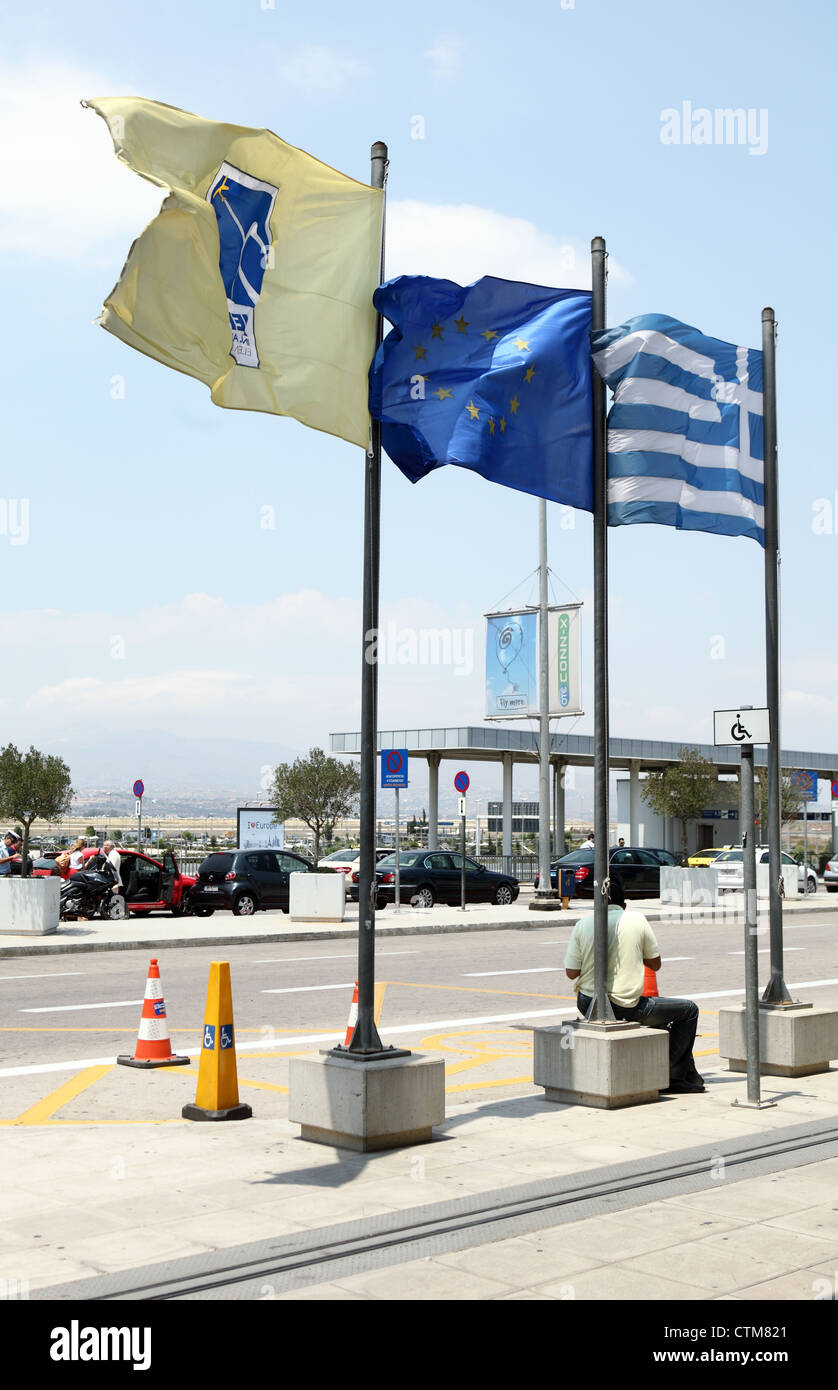 Flags of Greece the EU and Athens airport flying outside the arrival ...