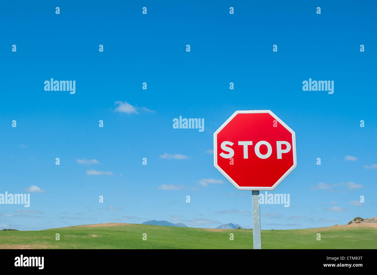 Stop sign over blue sky background Stock Photo - Alamy