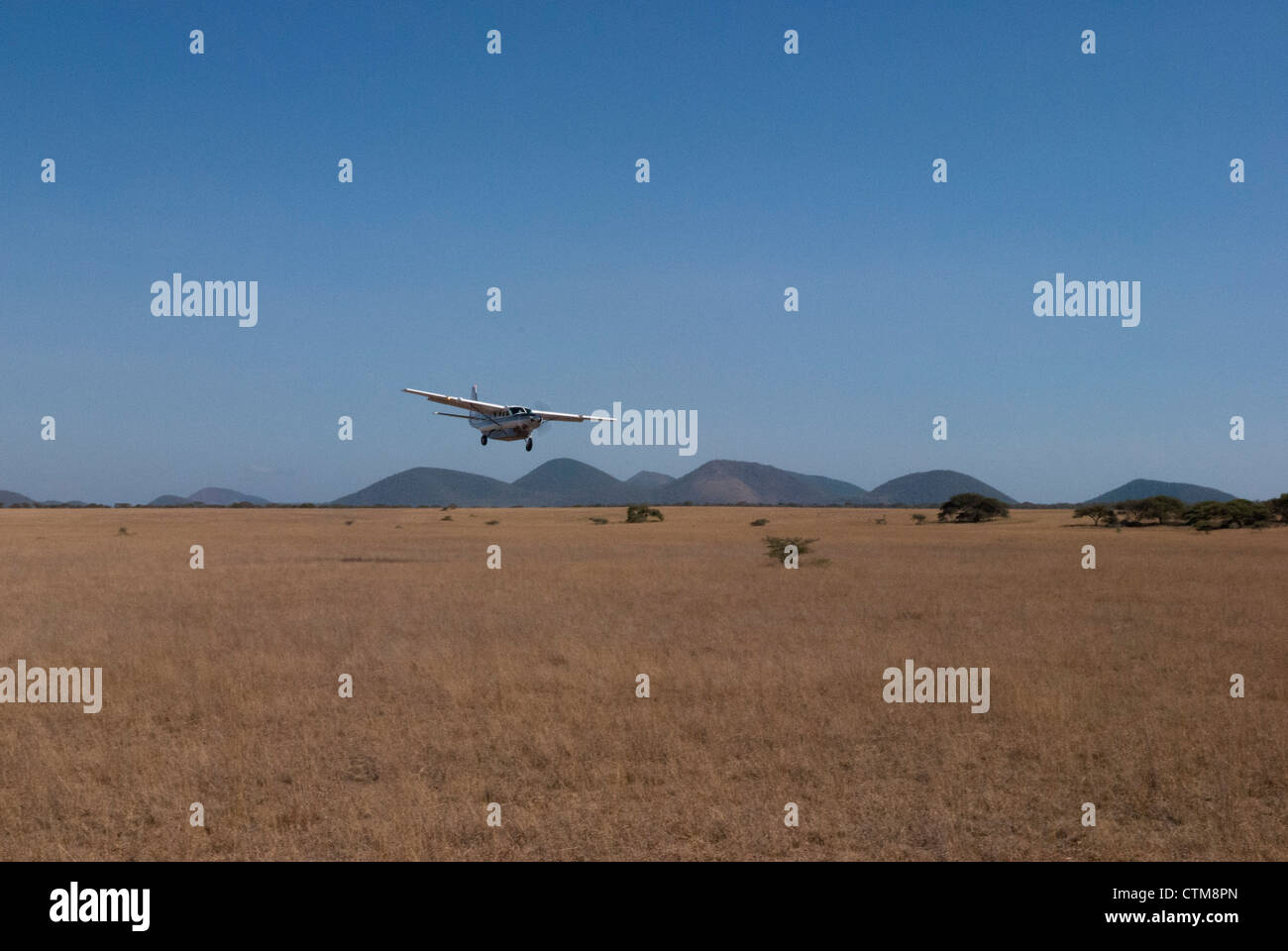 Light aircraft landing at Chyulu Hills, Kenya Stock Photo - Alamy