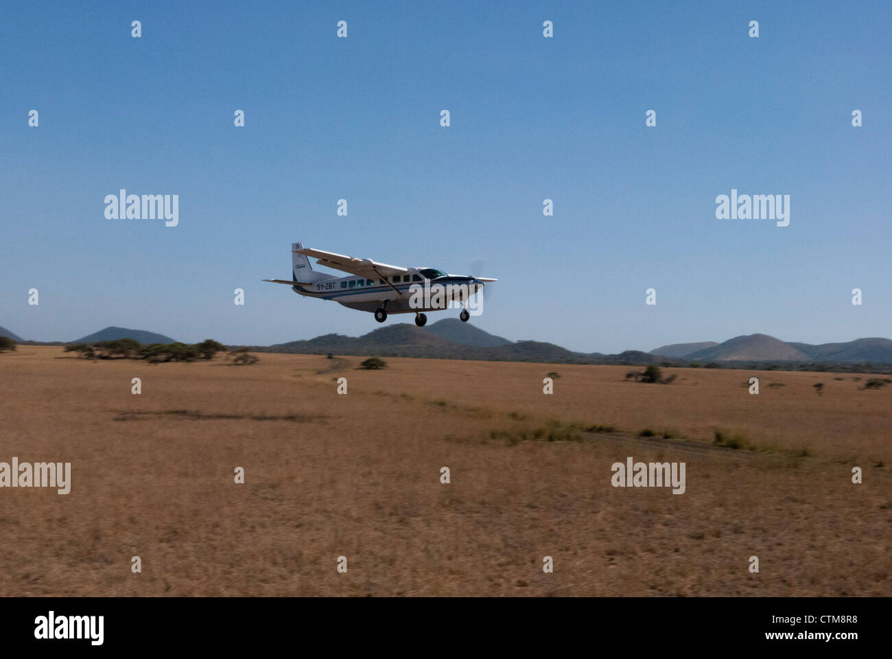 Light aircraft landing at Chyulu Hills, Kenya Stock Photo - Alamy