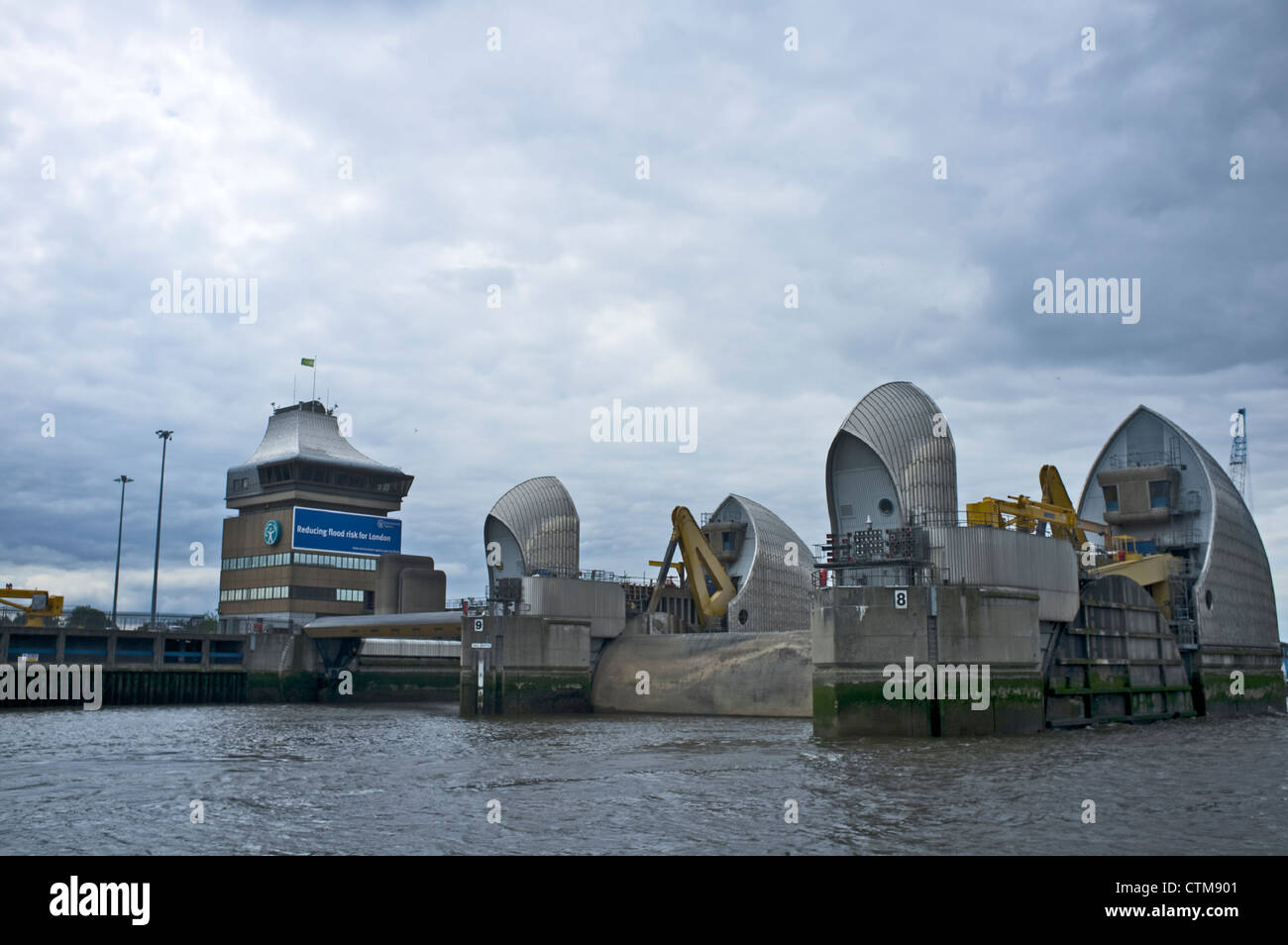 Thames flood barrier with one gate raised Stock Photo - Alamy