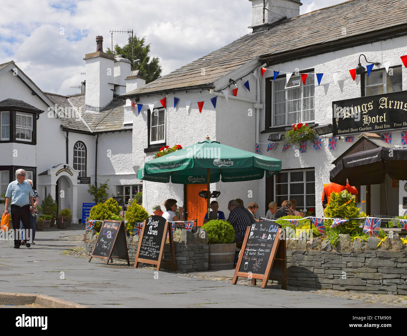 People tourists visitors enjoying a drink at the Kings Arms Hotel pub ...