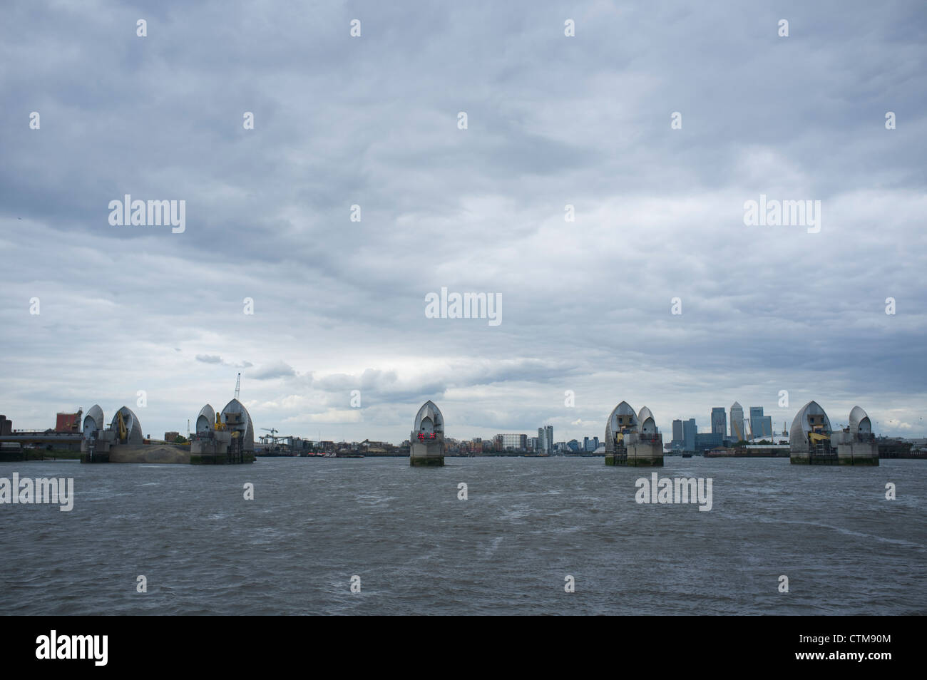 Thames flood barrier with one gate raised Stock Photo - Alamy