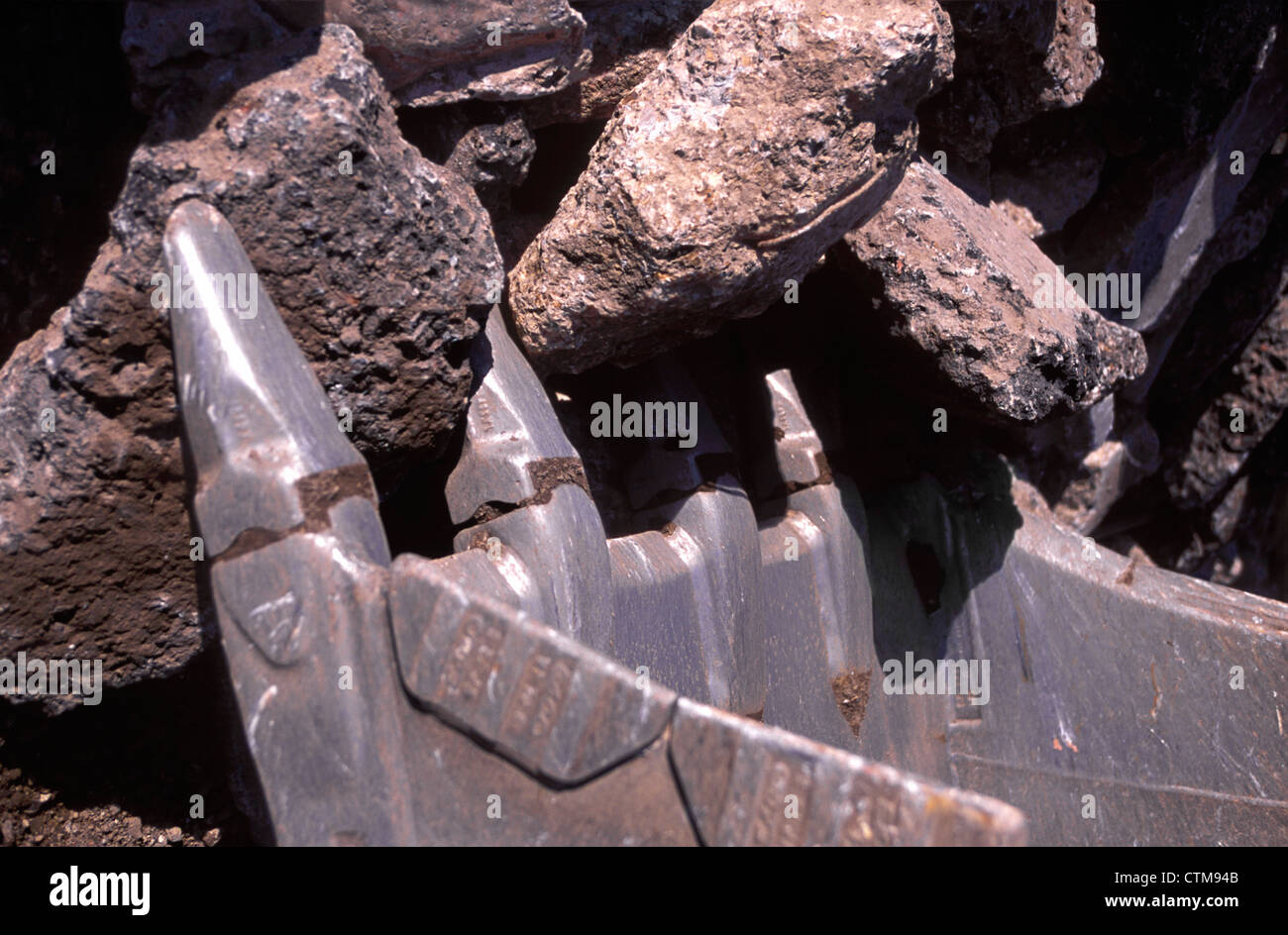 Detail of excavator bucket and rocks Stock Photo - Alamy