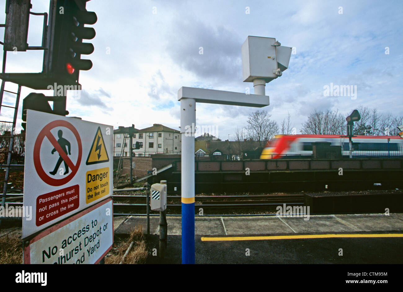Danger signs at the edge of a station platform Stock Photo - Alamy