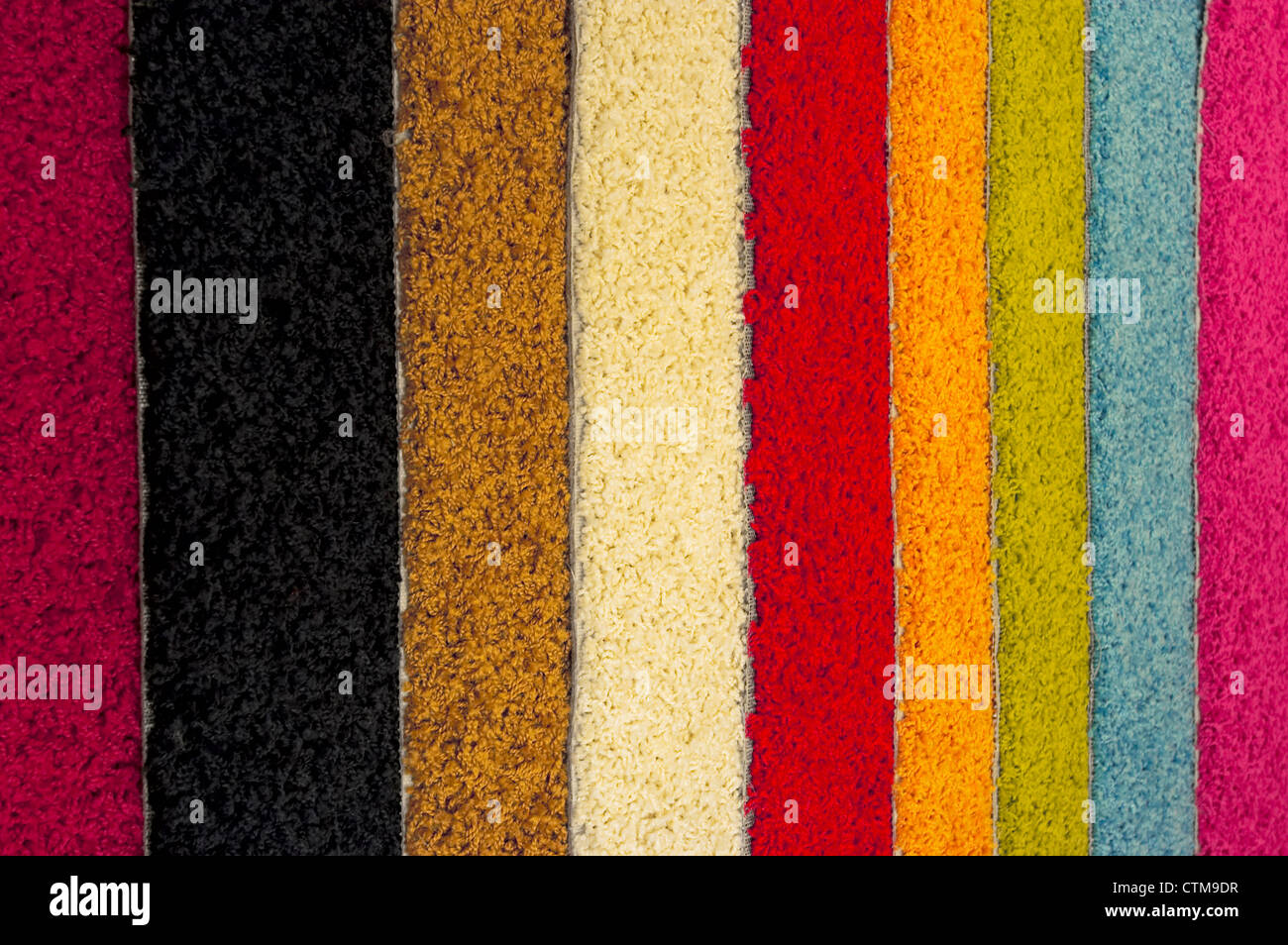 Rack of carpet on display in carpet shop Stock Photo - Alamy