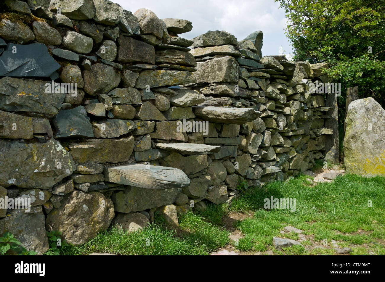 Stile and steps set in dry stone wall Cumbria Lake District National ...