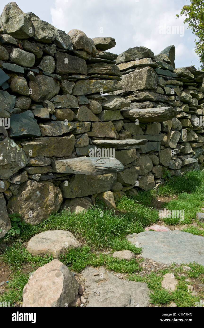 Stile steps set in dry stone wall Cumbria Lake District National Park ...