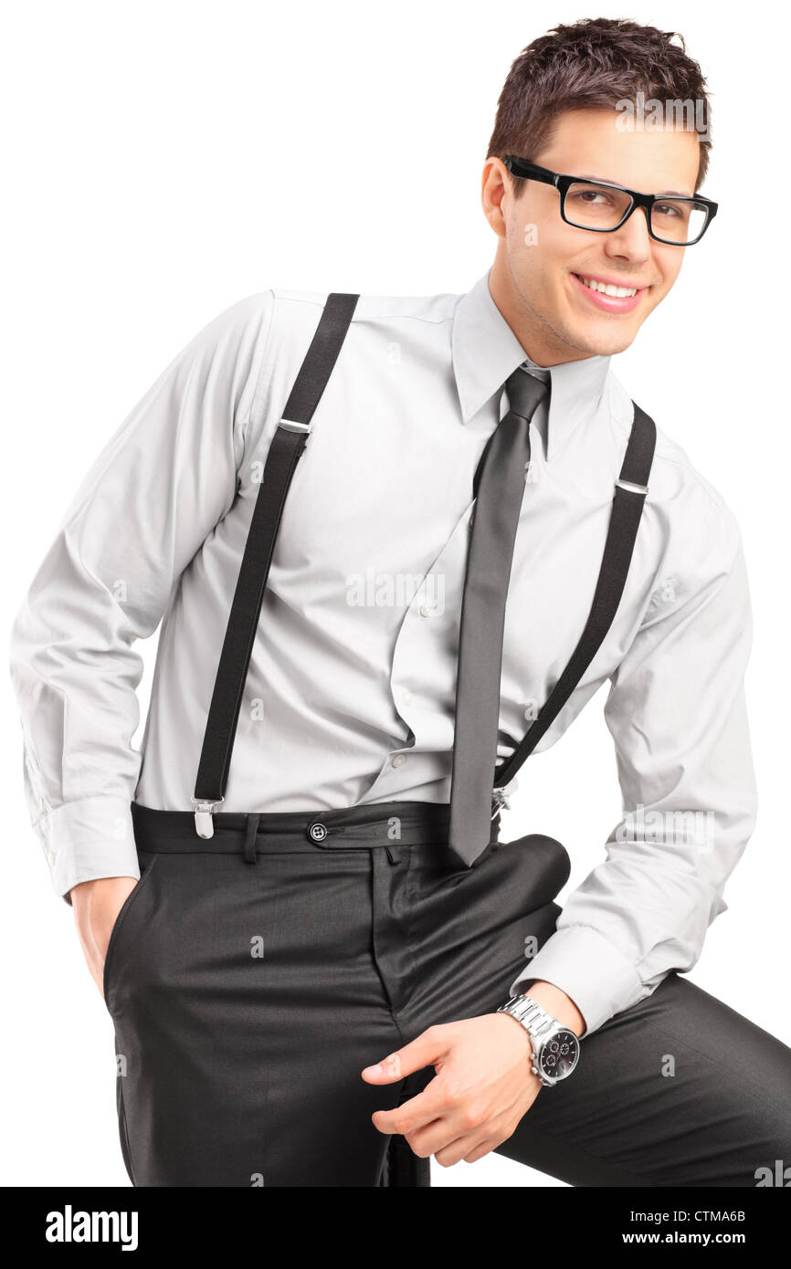 A young handsome male sitting on a chair isolated on white background ...