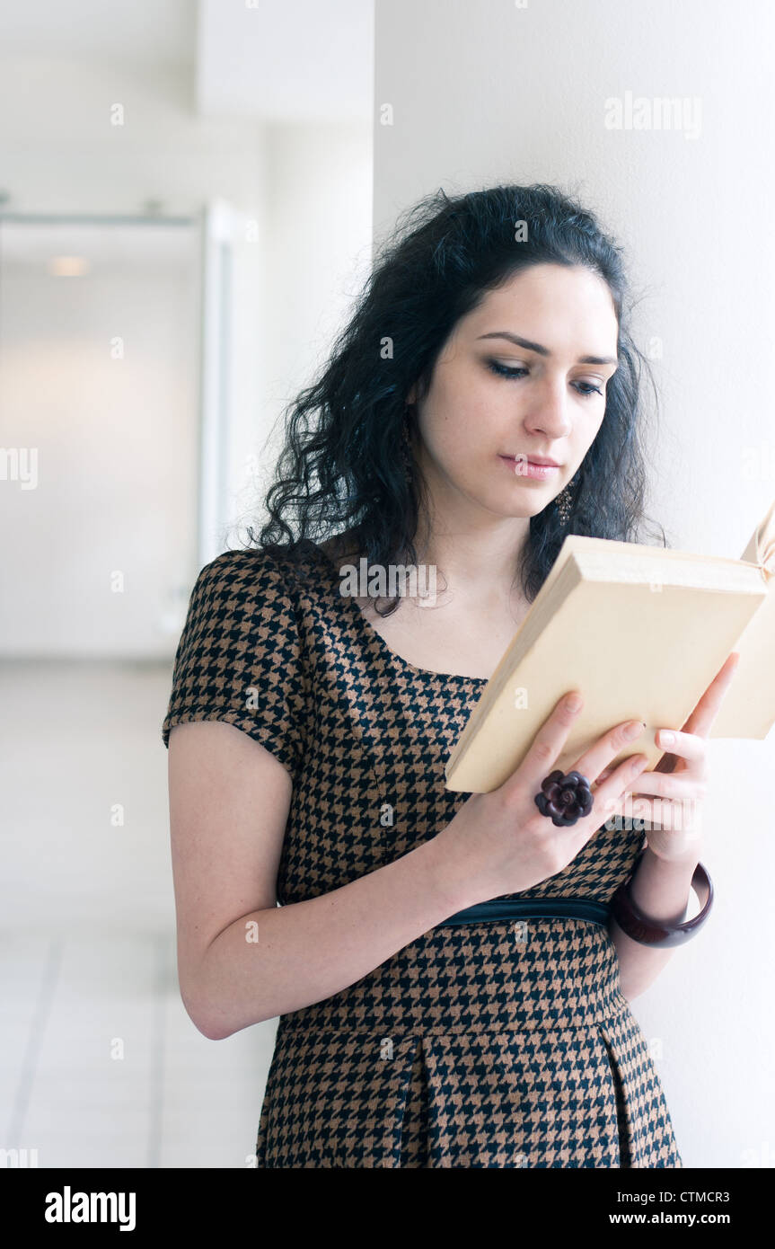 Portrait of a student reading a book Stock Photo - Alamy