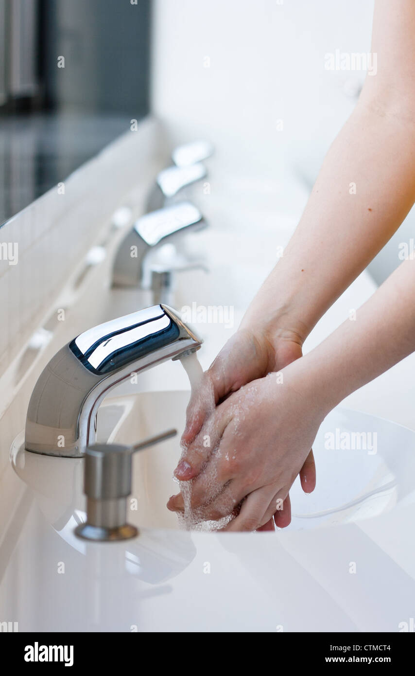 Washing hands in a public restroom (selective focus Stock Photo - Alamy