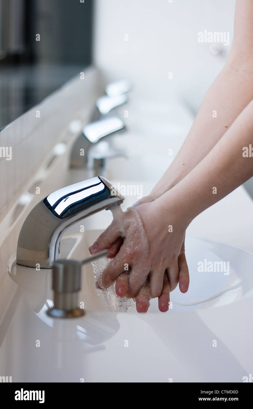 Washing hands in a public restroom (selective focus Stock Photo - Alamy