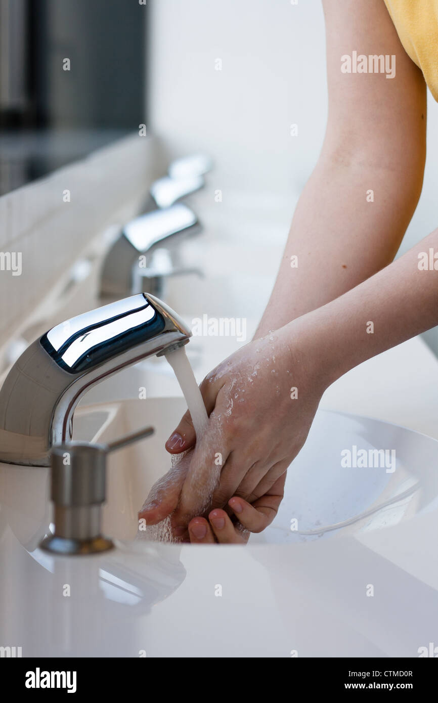 Washing hands in a public restroom (selective focus Stock Photo - Alamy