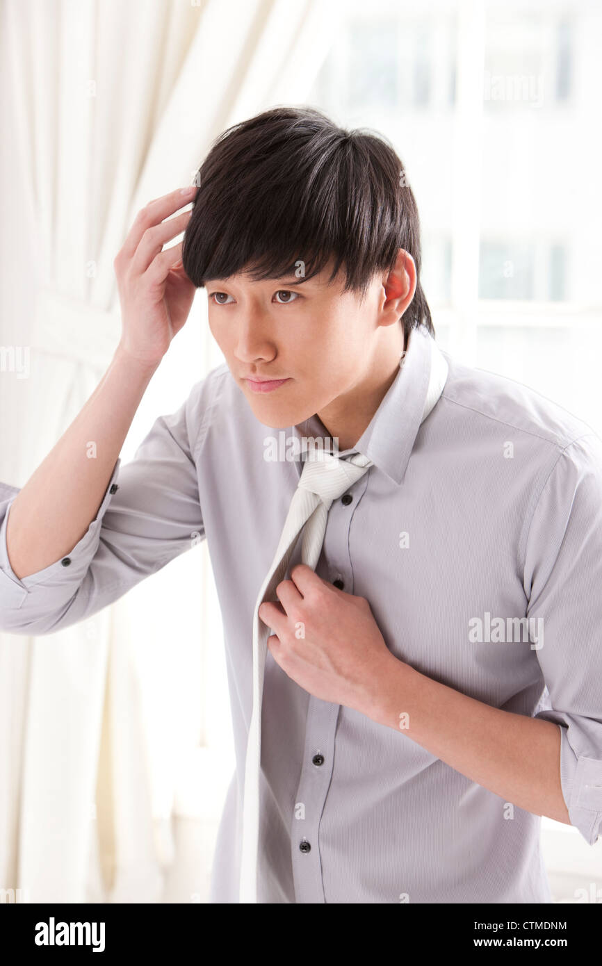 Young man preparing for going out Stock Photo - Alamy