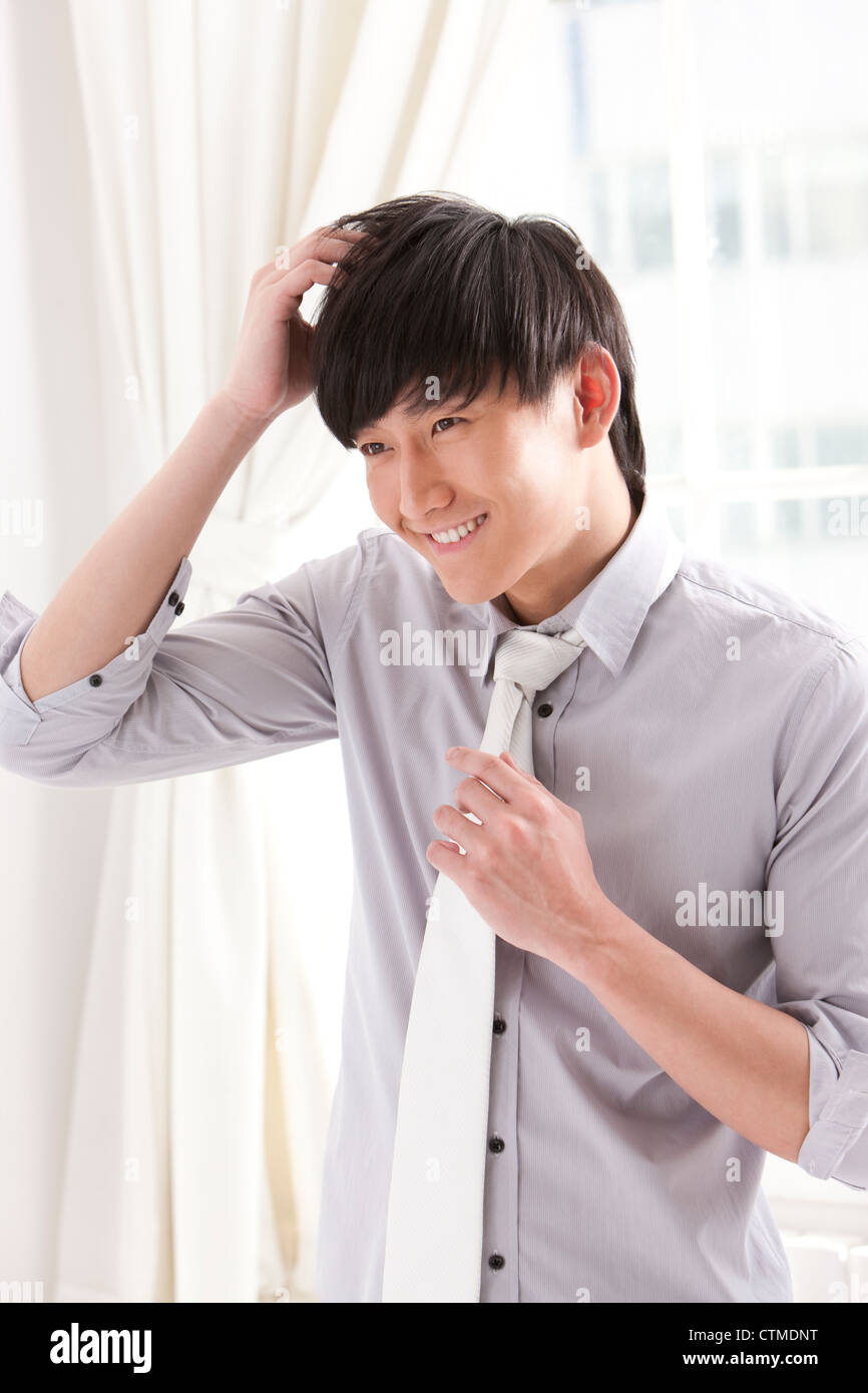 Young man preparing for going out Stock Photo - Alamy