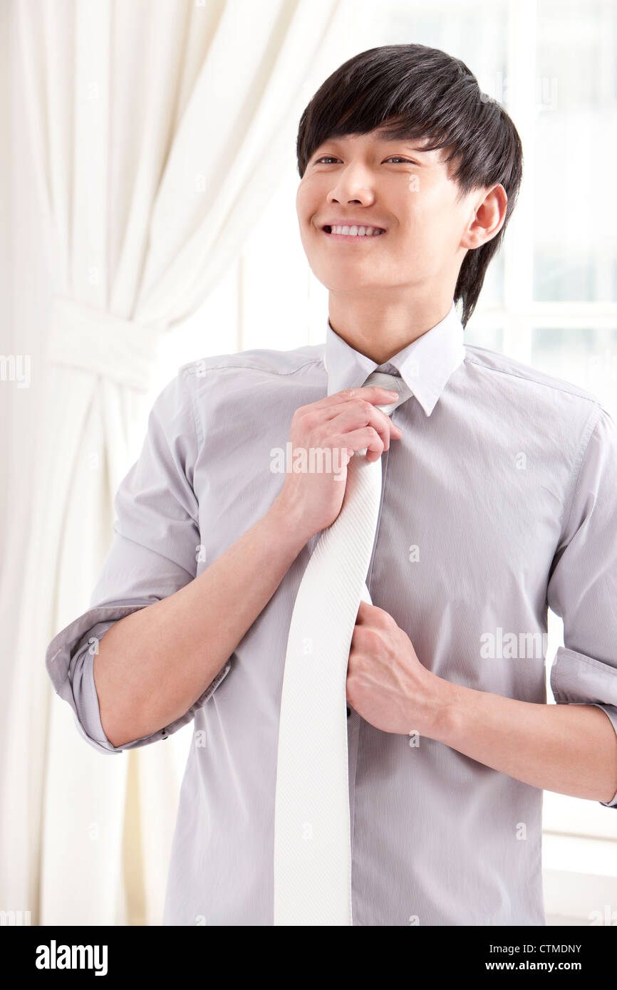 Young man preparing for going out Stock Photo - Alamy