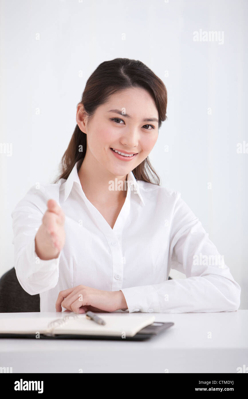 Young businesswoman pointing the front Stock Photo - Alamy