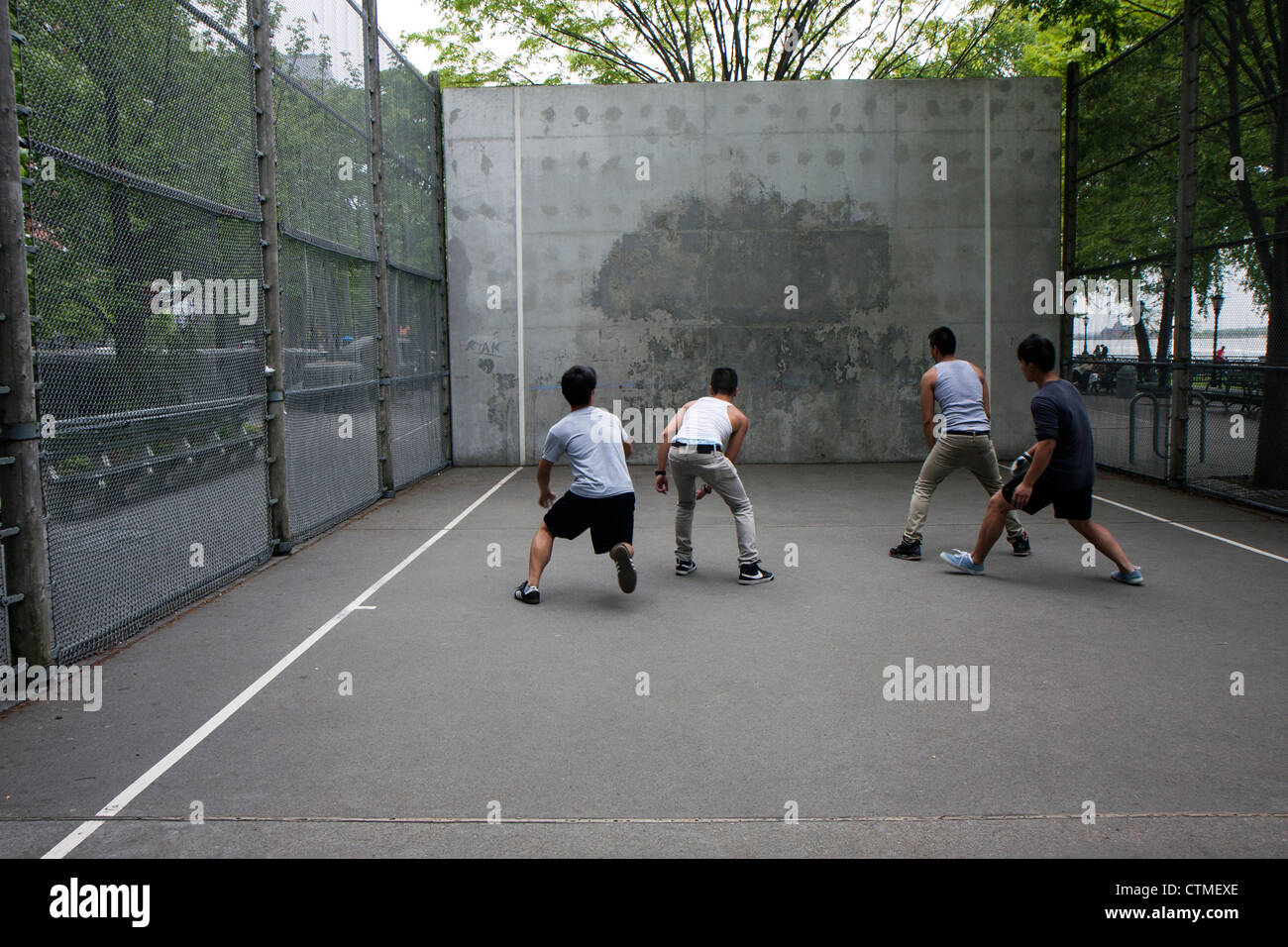 A group of boys play handball in a city facility Stock Photo - Alamy