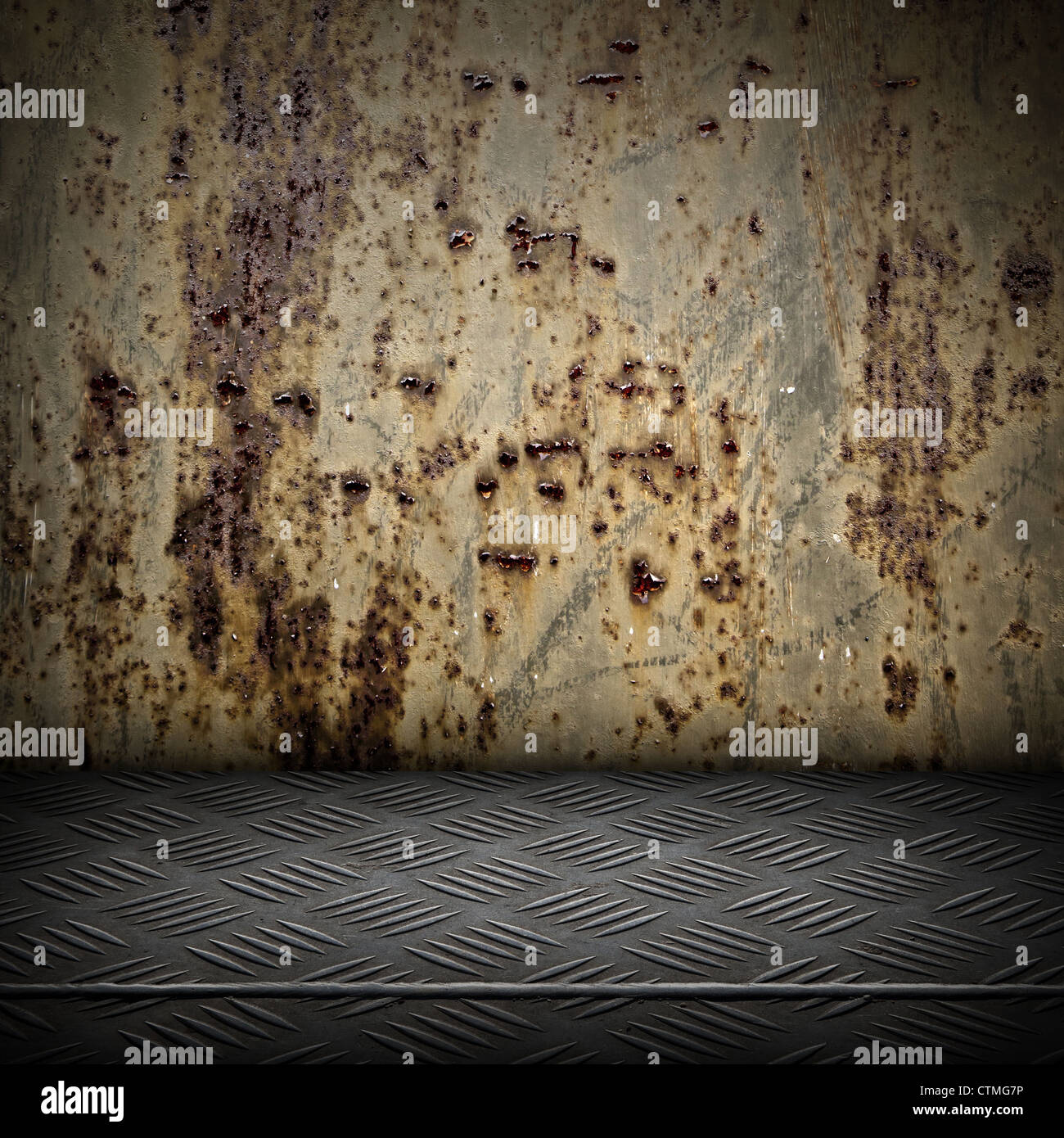 Grunge interior with rusted metal wall and diamond metal plate floor ...