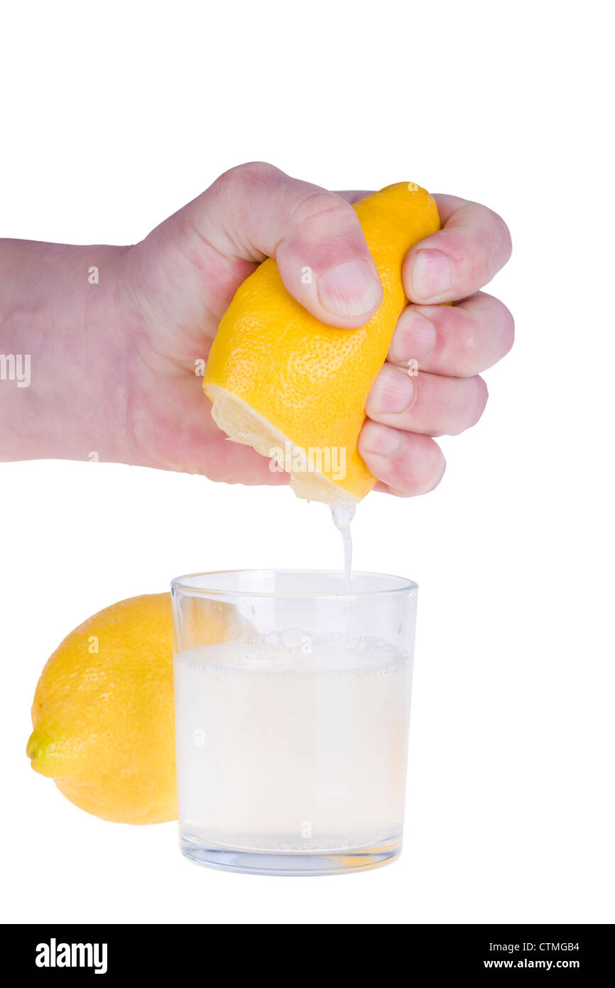 Squeezing lemon on white background Stock Photo - Alamy
