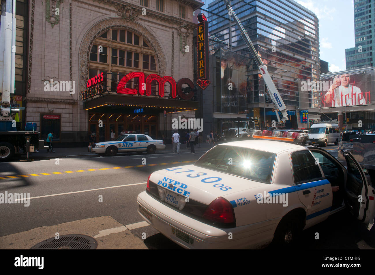 NYPD officers outside the latest Batman film, "The Dark Knight Rises ...