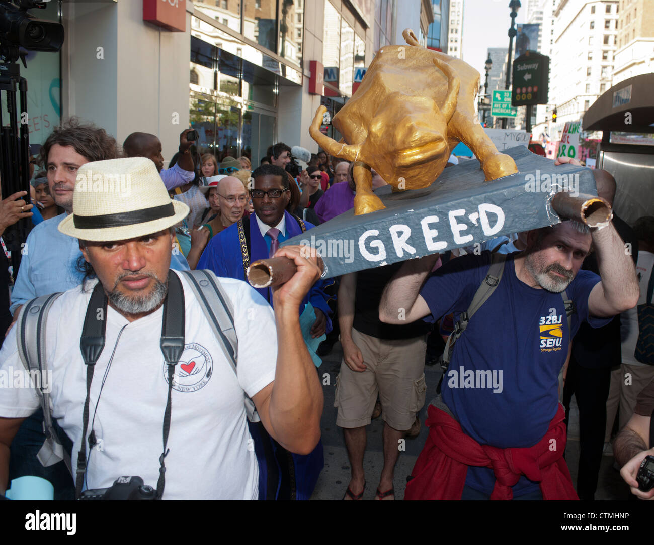 Hundreds of workers and supporters march in a demonstration for a ...