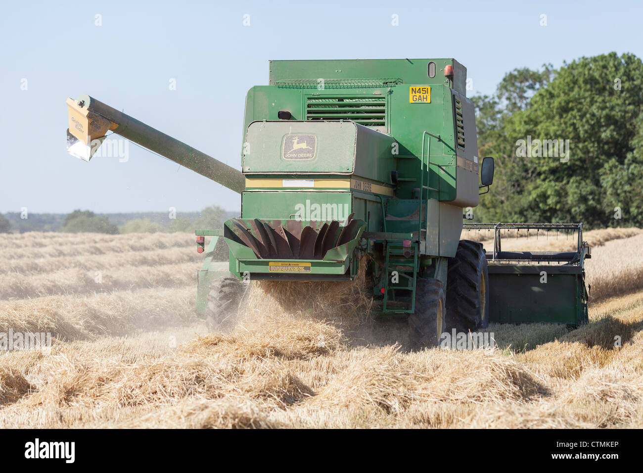 Farmers harvesting the corn crop during a brief dry spell in the ...