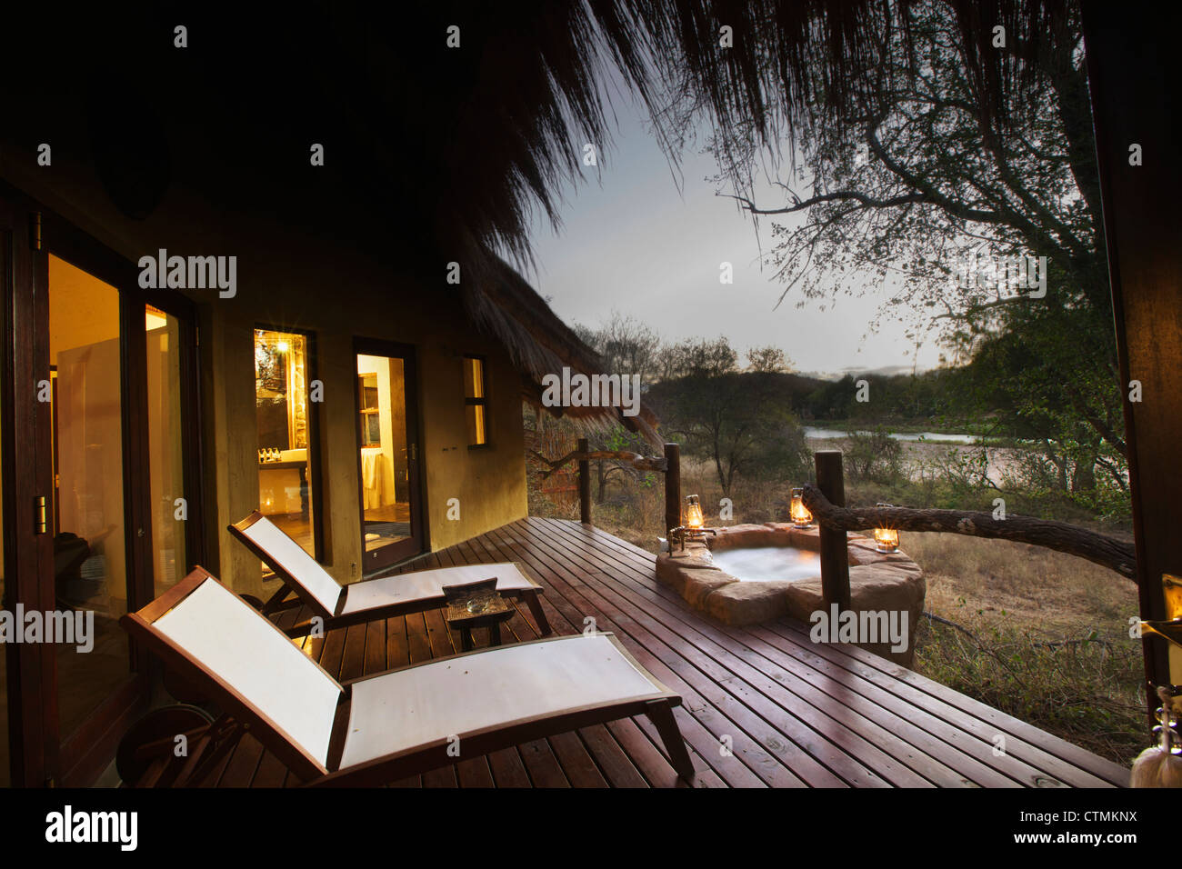 A patio with chairs and a jacuzzi, Pondoro Game Lodge, Balule Private ...