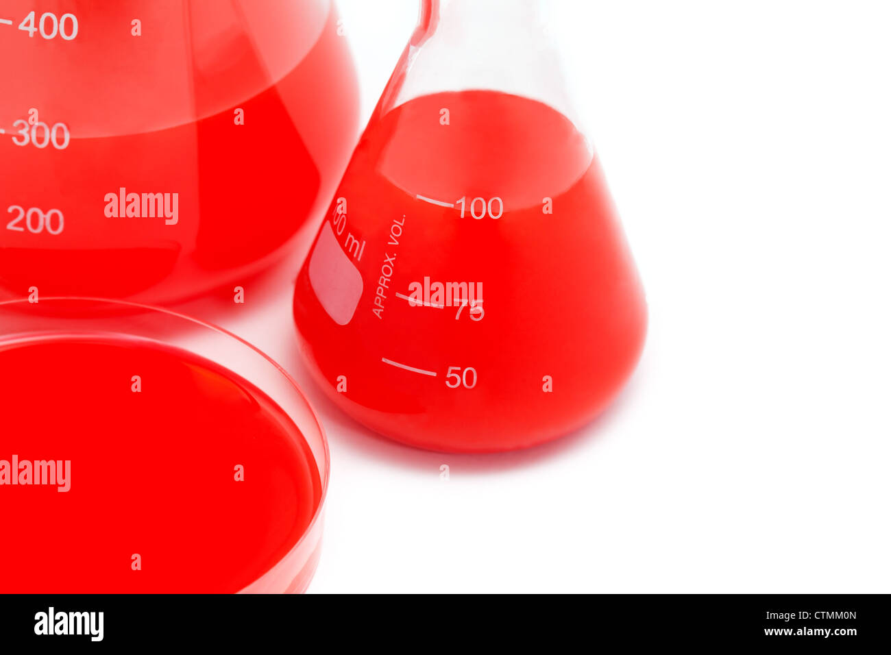 laboratory glasswear with red chemical solutions on white Stock Photo ...