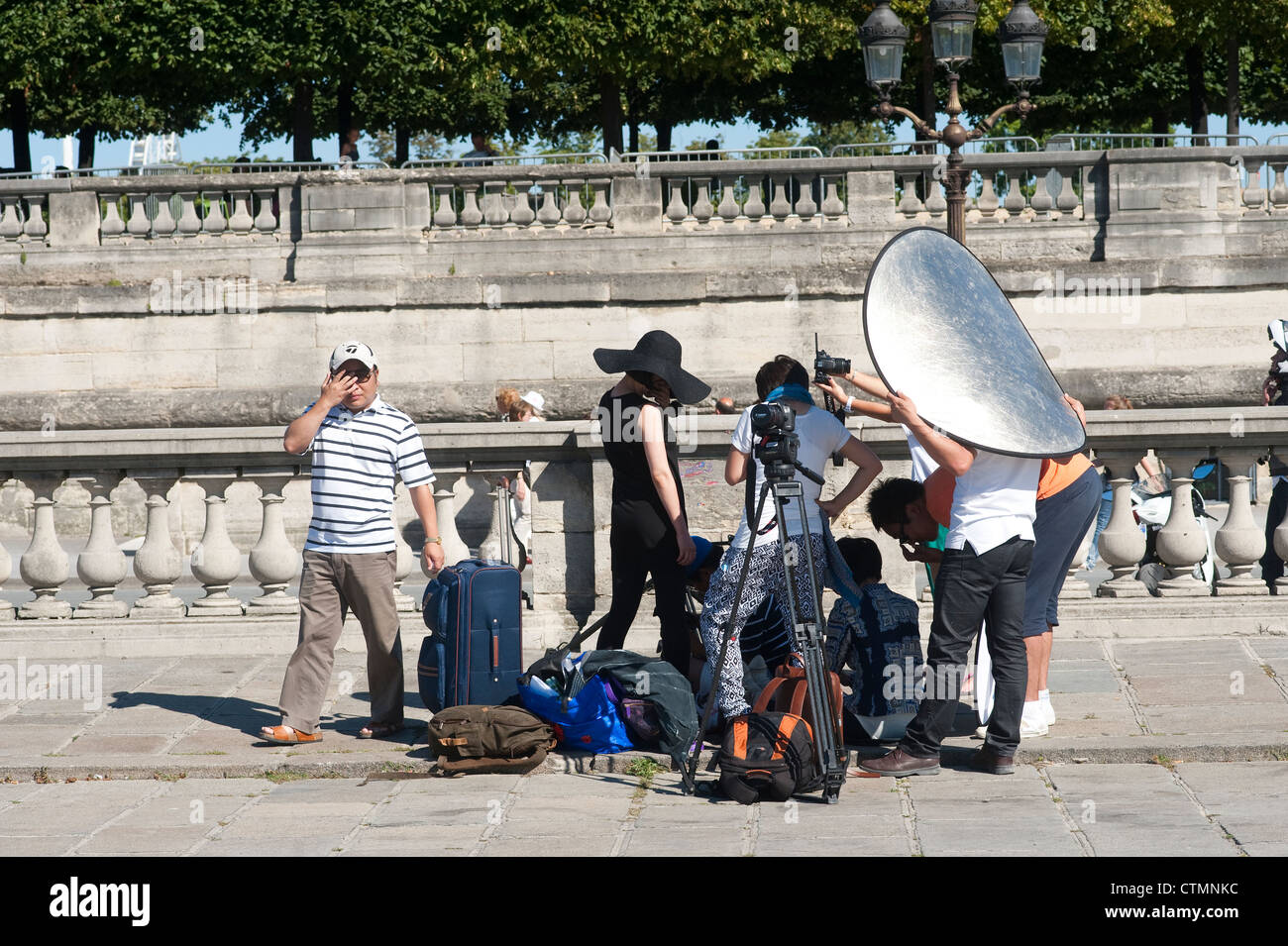 Paris, France - A crew doing photo shoot in the streets, female model ...