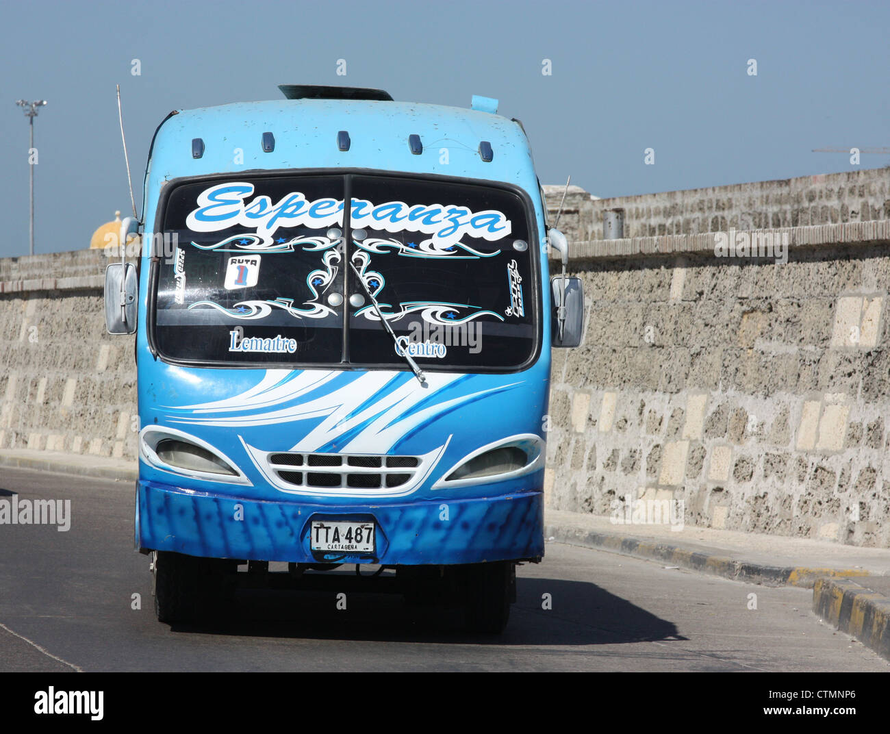 Brightly decorated local bus (chicken bus) picking up passengers in Old ...