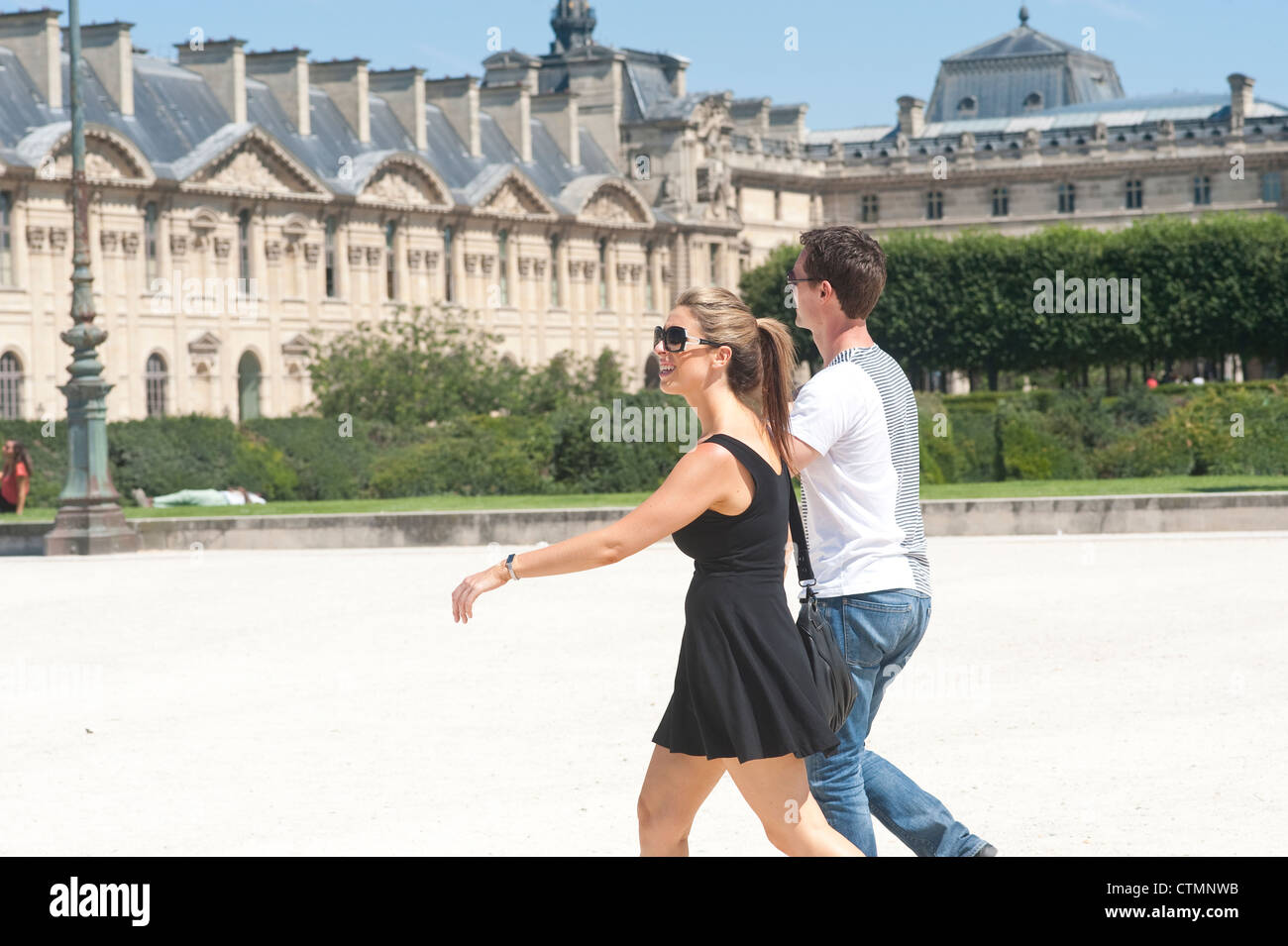 Paris, France - A young couple walking in the Louvre area Stock Photo ...