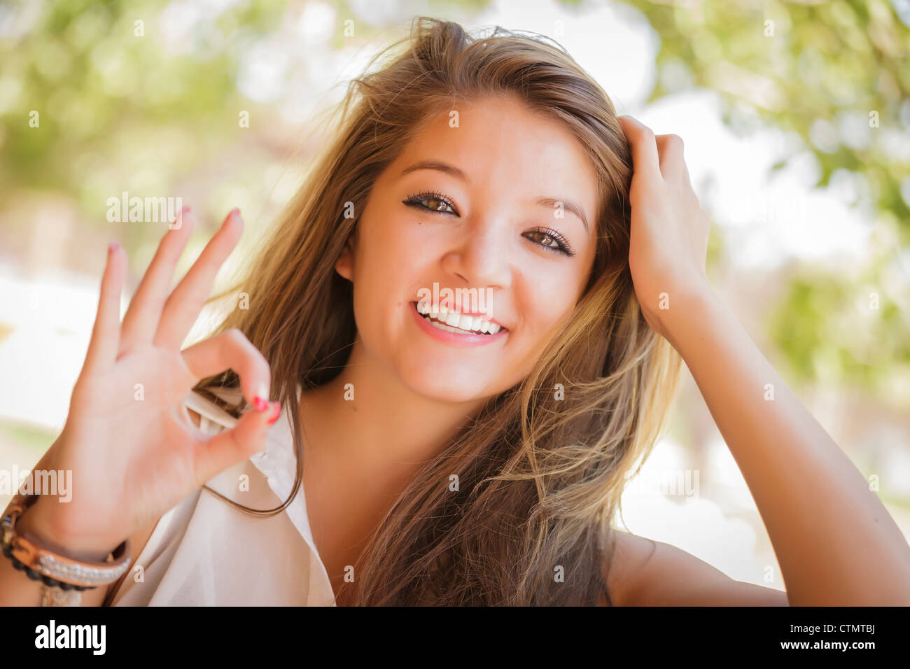 Attractive Smiling Mixed Race Girl Portrait with Okay Hand Sign ...