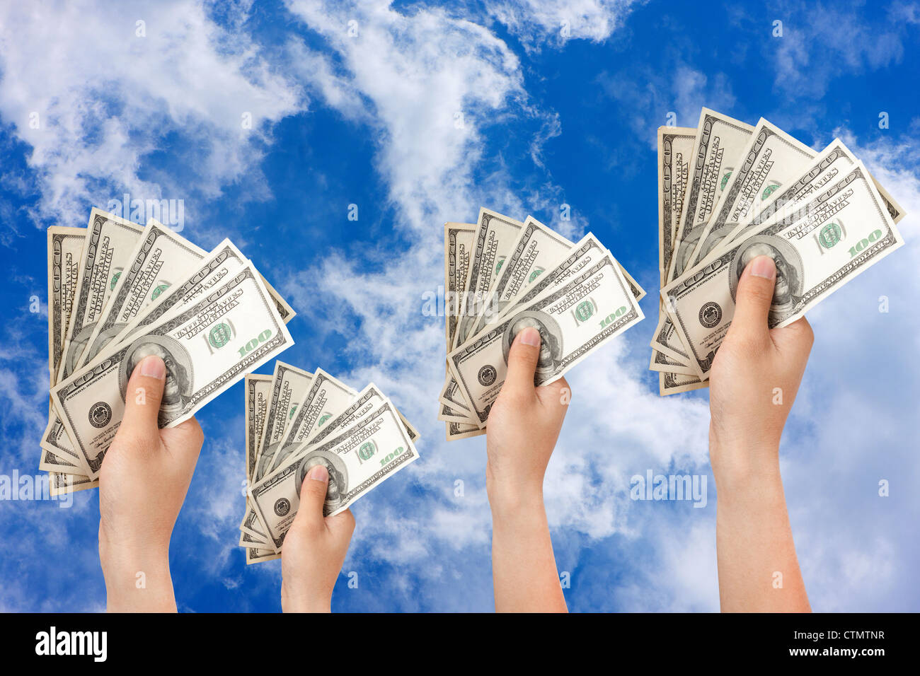 human hand with money sky background Stock Photo - Alamy