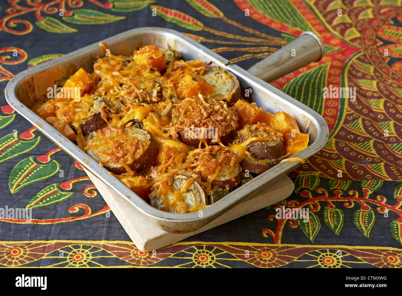 Traditional African cooking. Sweet potatoes and vegetable bake with ...