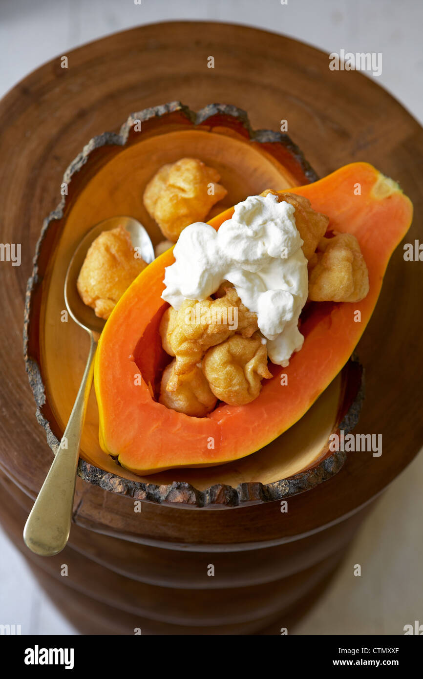 Traditional African cooking. Papino boats with mandazi and cream ...