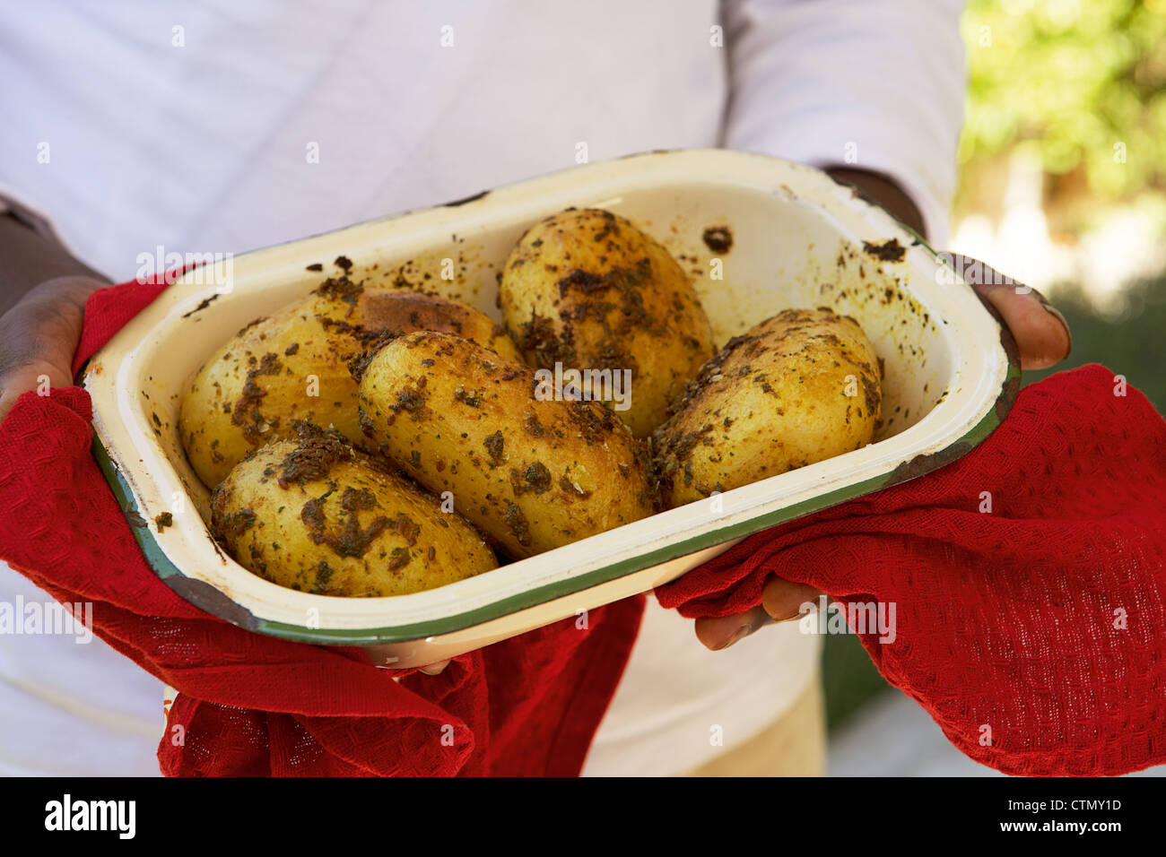 Traditional African cooking. Charmoula potatoes made with herbs and ...