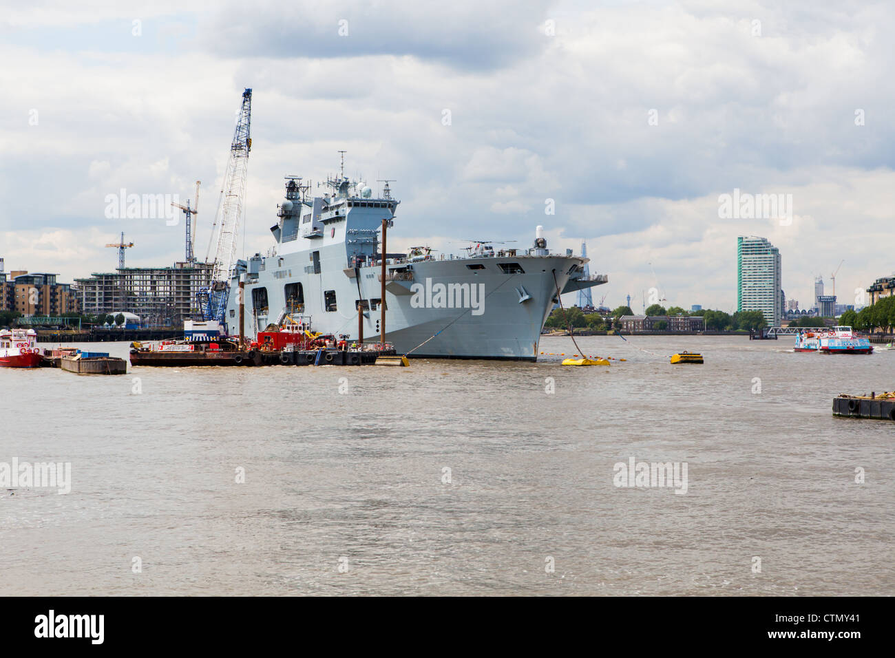 HMS Ocean moored in Greenwich with the City of London behind her Stock ...