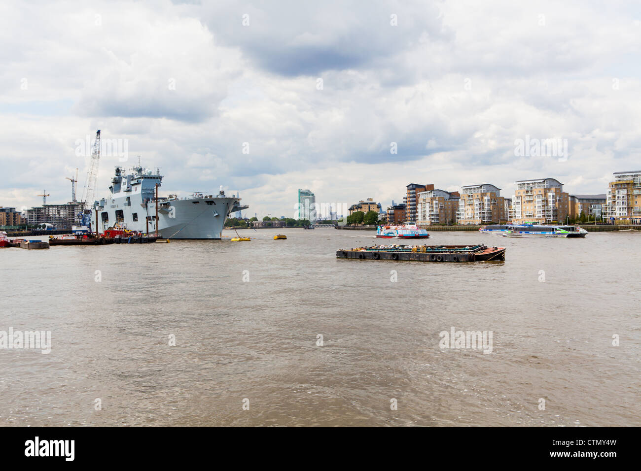 HMS Ocean moored in Greenwich with the City of London behind her Stock ...