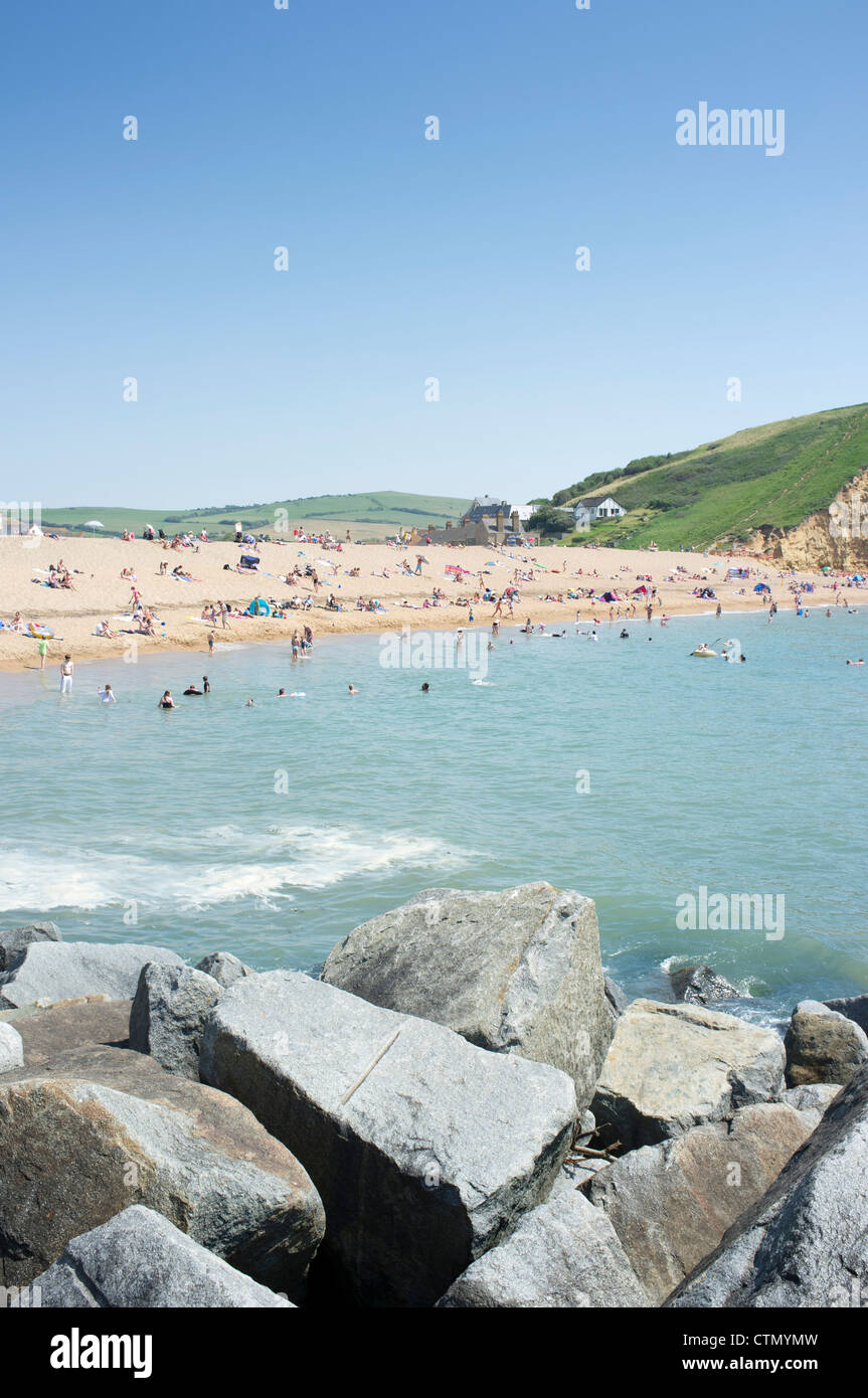 People on the beach at West Bay on the Dorset coast UK Stock Photo - Alamy
