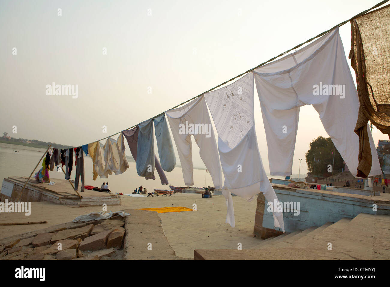 Clothing and fabric on washing line at the river Ganges, Varanasi ...