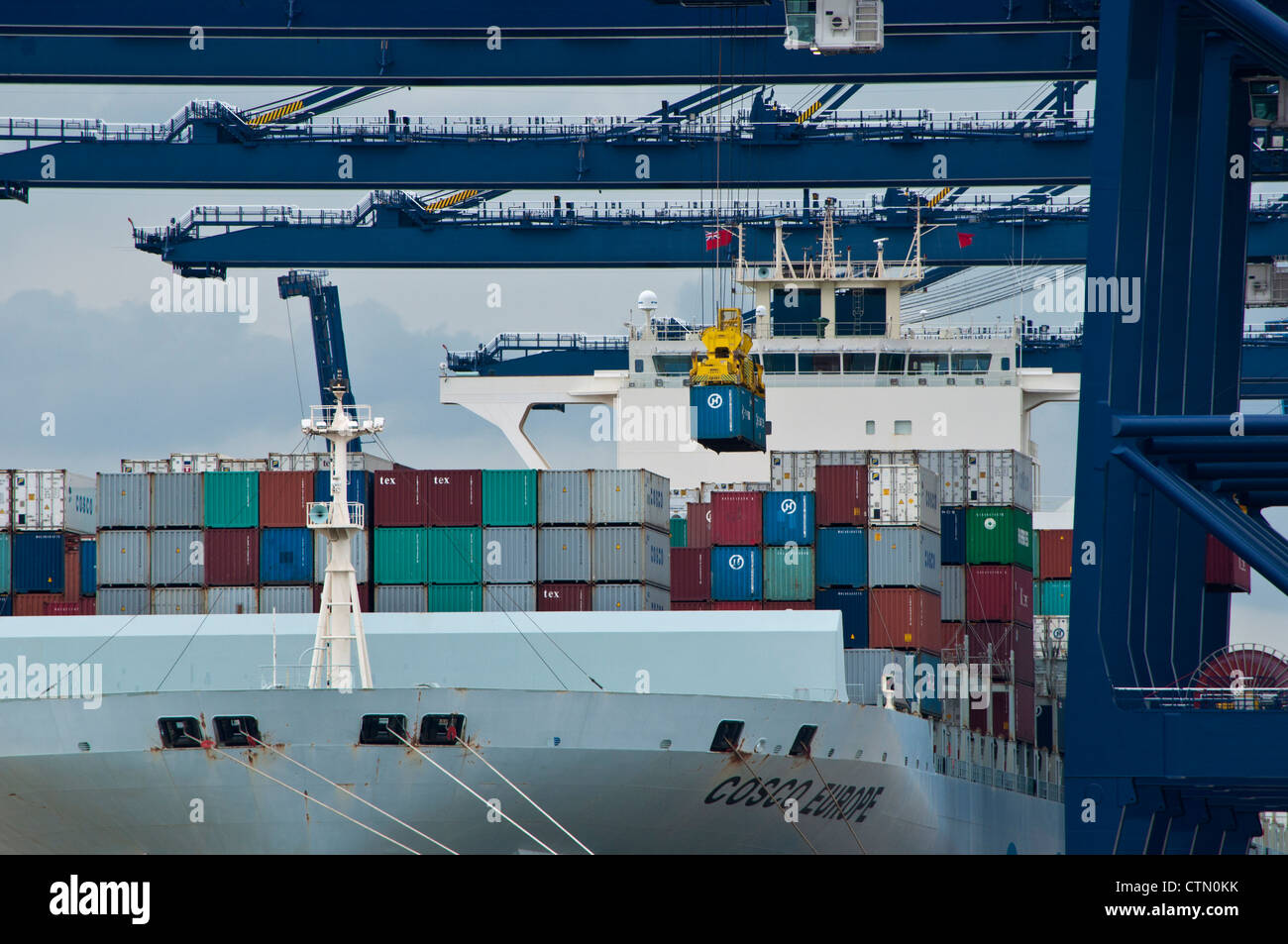Loading shipping containers onto ship “Cosco Europe” Stock Photo - Alamy