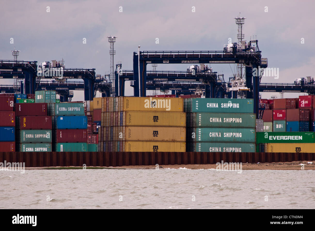 Shipping containers on dock side Stock Photo - Alamy